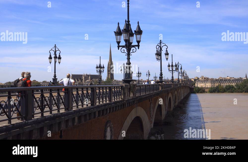Tramway crossing the Pont de pierre bridge in the streets of Bordeaux ...