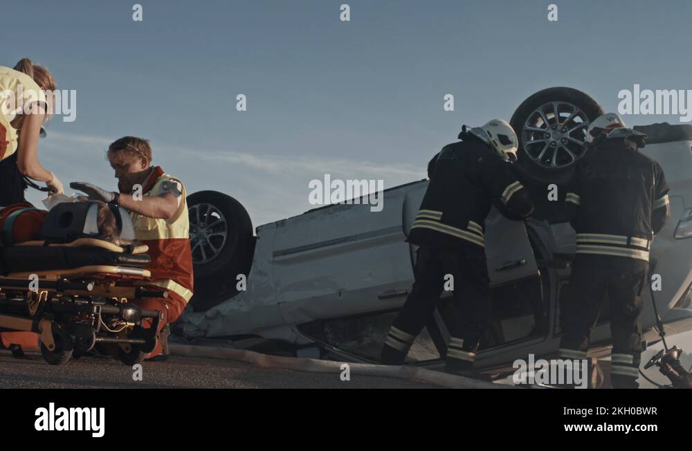 On the Car Crash Traffic Accident Scene: Paramedics Save Life of a ...