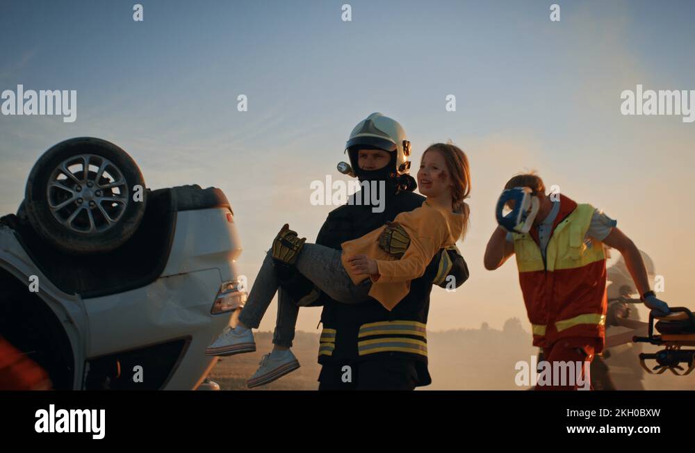 Firefighter Carries Injured Young Girl to Safety where She Reunited ...