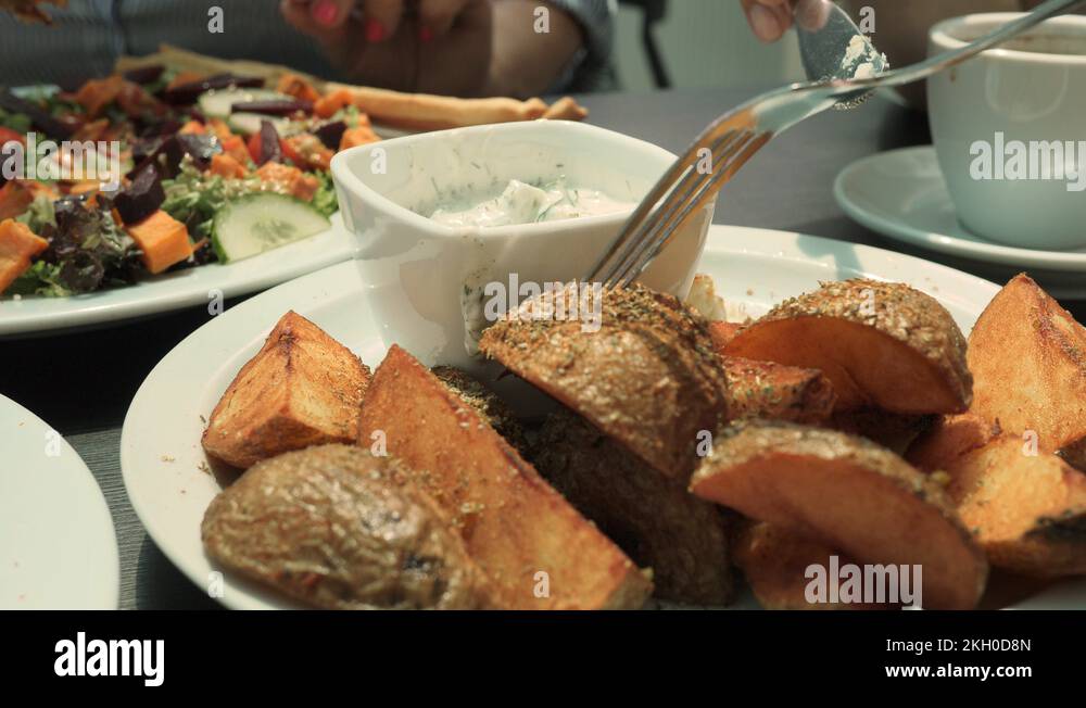 Eating in restaurant variety of dishes healthy vegetable salad and ...