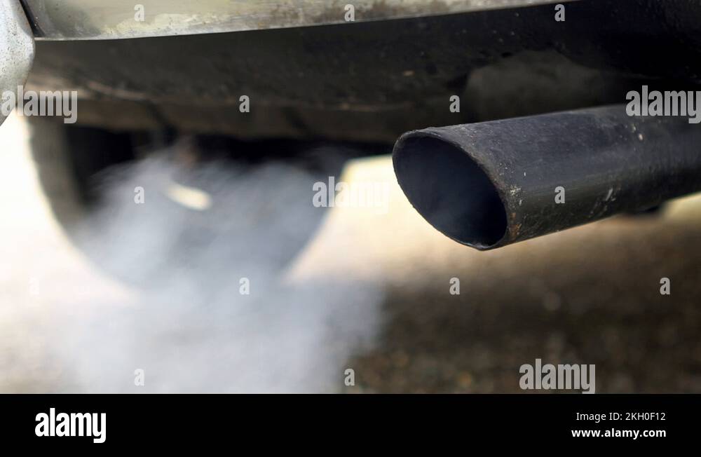 Slow Motion combustion fumes coming out of car exhaust pipe, strongly ...