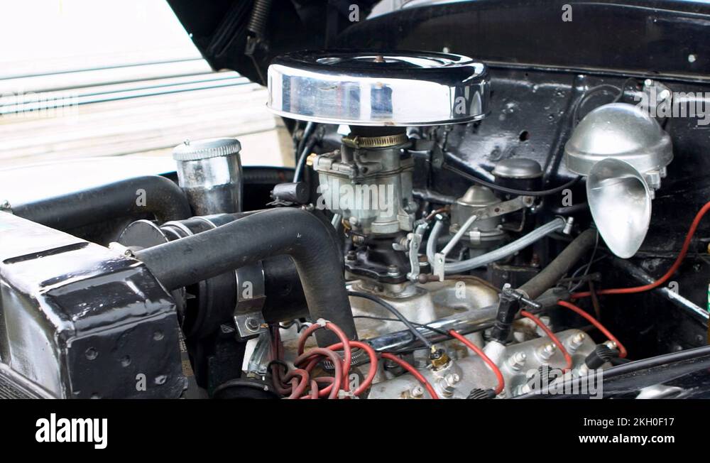 Vintage car engine under hood of a classic American Ford Mercury Eight ...