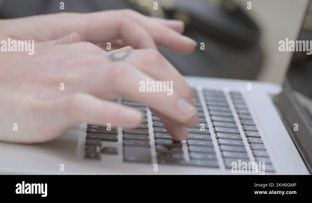 Girl typing on laptop keyboard outdoor. Close up woman hands writing on ...