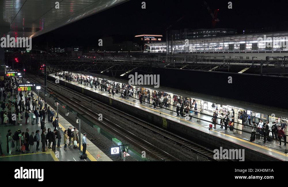 Trains traffic on multi-level platforms of Kyoto Railway Station. Japan ...