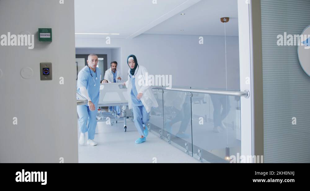 Doctors running with patient in hospital bed in emergency 4k Stock ...