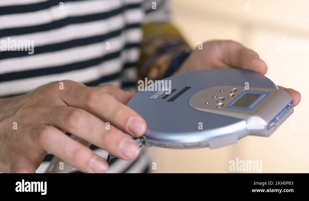 Inserting a Disk into a Portable CD Player Closeup Stock Video Footage ...