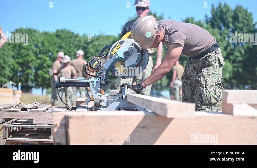 Soldier cutting length of timber with circular saw Stock Video Footage ...