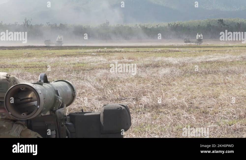 Soldier aiming RBS 70 MANPAD with M142 HIMARS in launch position in ...