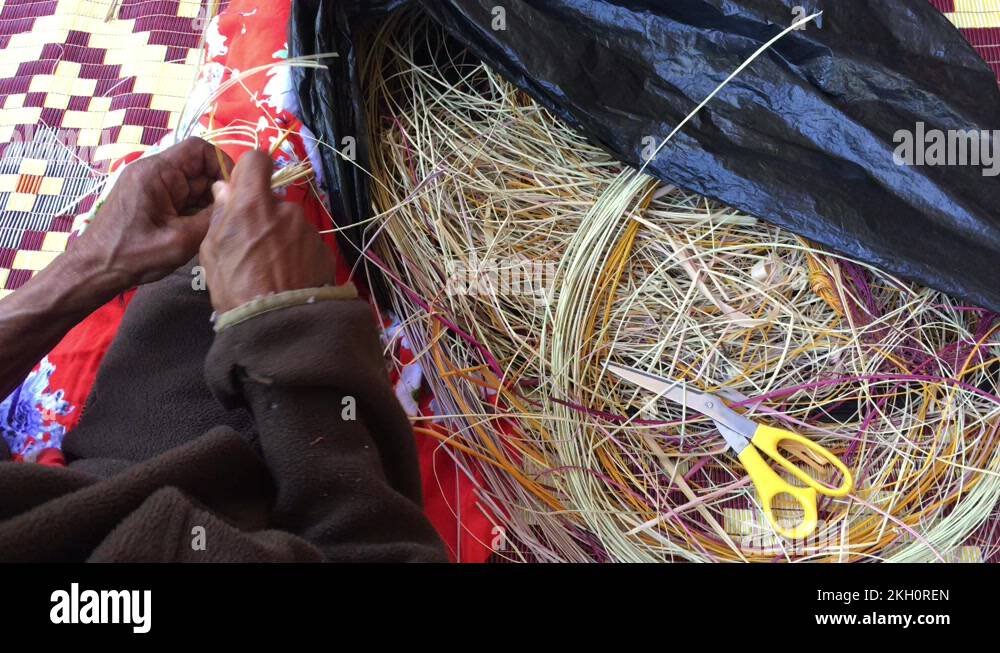 Native Australian Aboriginal woman basket weaving in Arnhem Land in the ...
