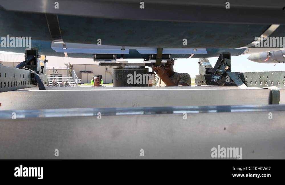 Munitions airman strapping bomb to bomb loader Stock Video Footage - Alamy