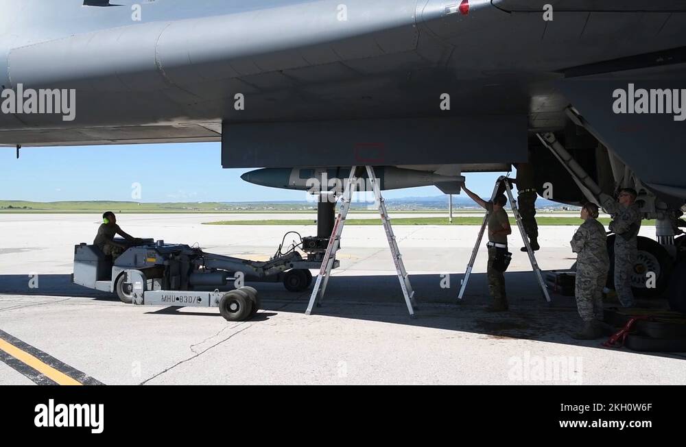 Munitions Airman loading ordnance into B2 Lancer with bomb loader Stock ...