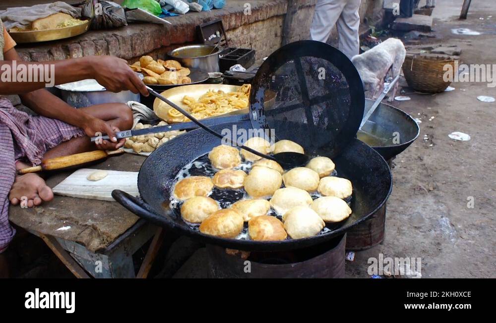 Indian Food Vendor Frying Puri at the Stall, Varanasi, India Stock ...