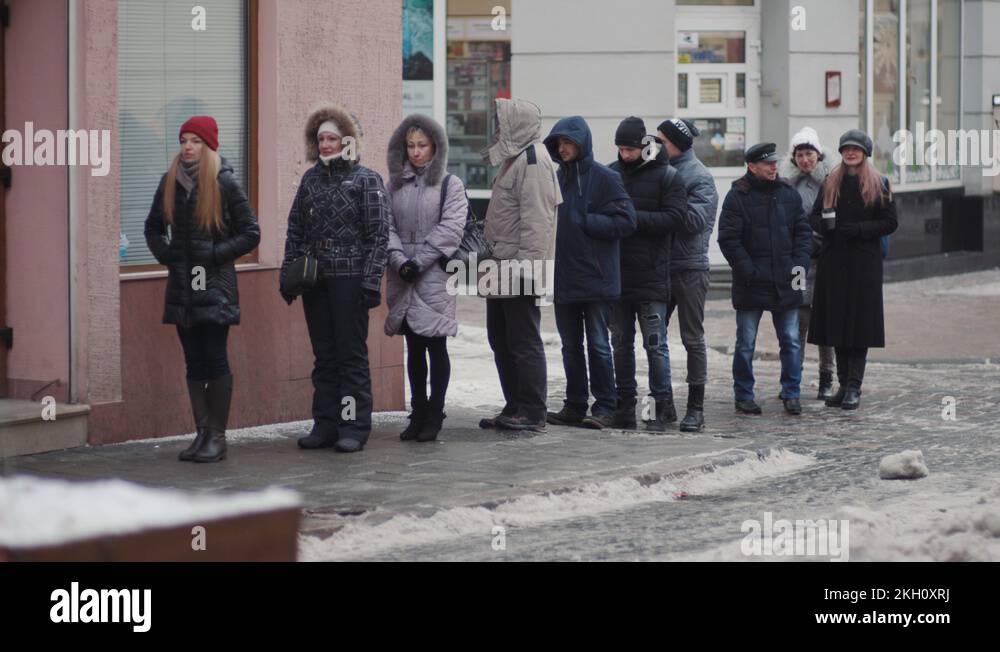 NEW YORK - April 19, 2019: In winter street queue of people waiting in ...