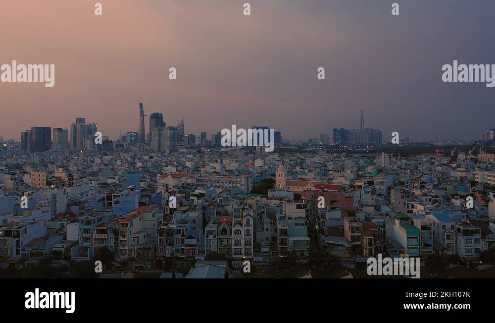 Evening reveal shot as camera moves in over a residential area and up ...