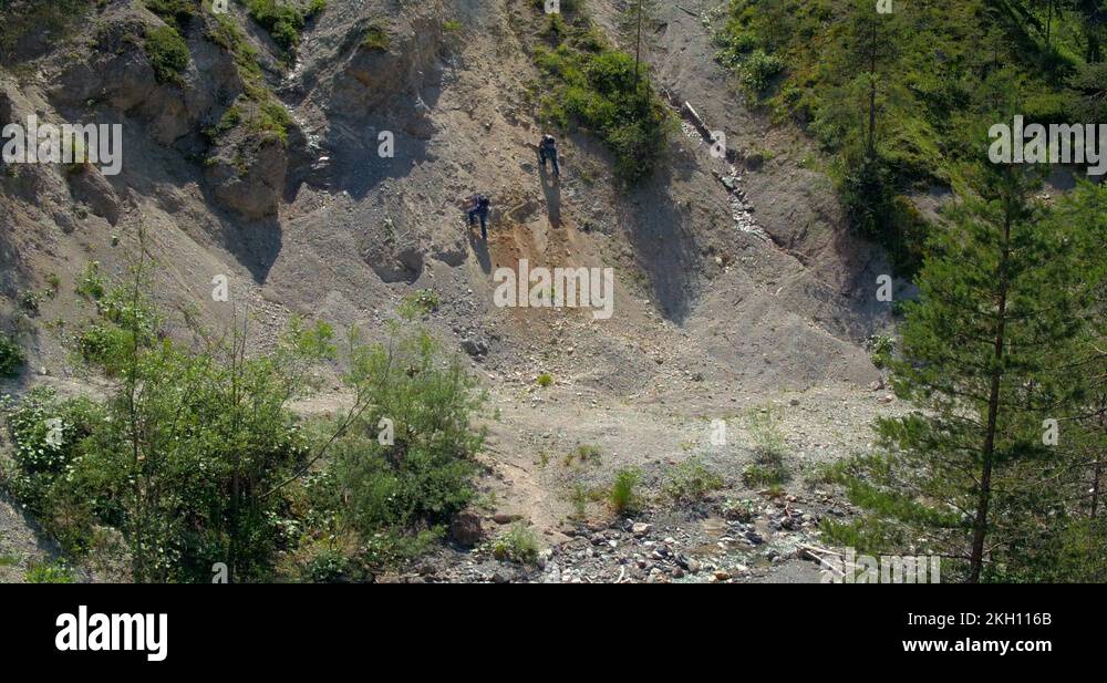 Drone Crane Shot Two Men Climbing To Top Of Slope Stock Video Footage ...