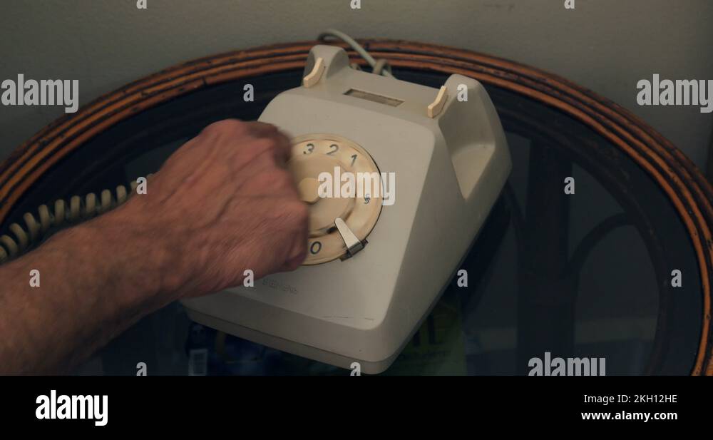 Rotary phone, Old telephone dial. Dialing a number on a telephone Stock ...