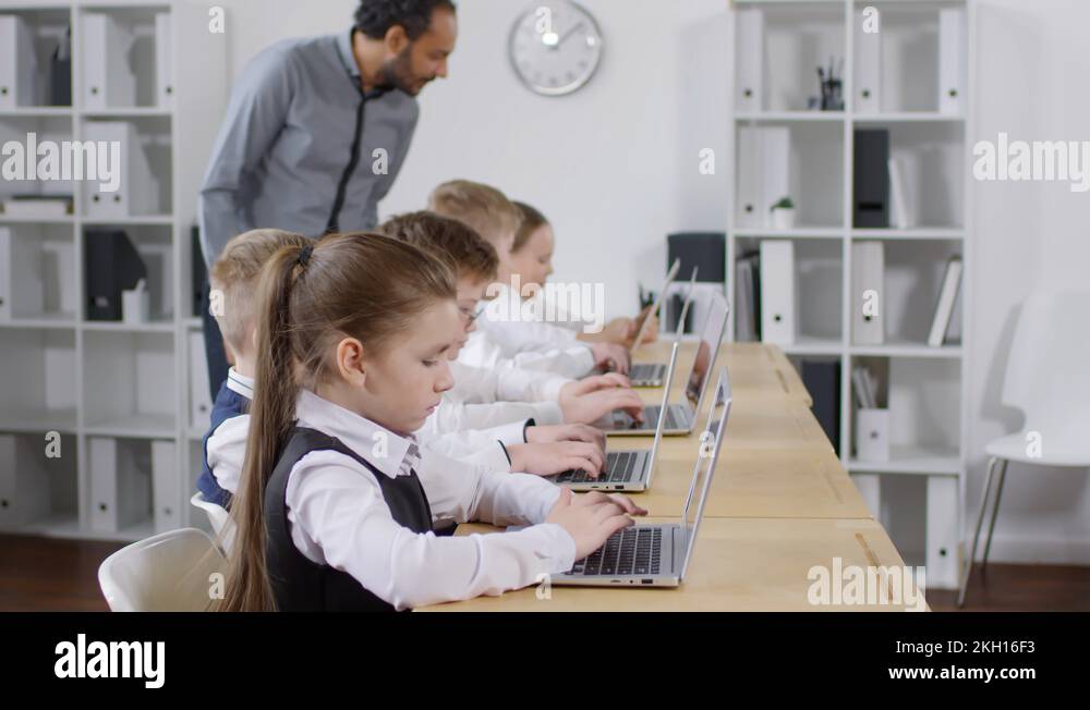 Preteen Pupils Learning to Use Laptops at School Stock Video Footage ...