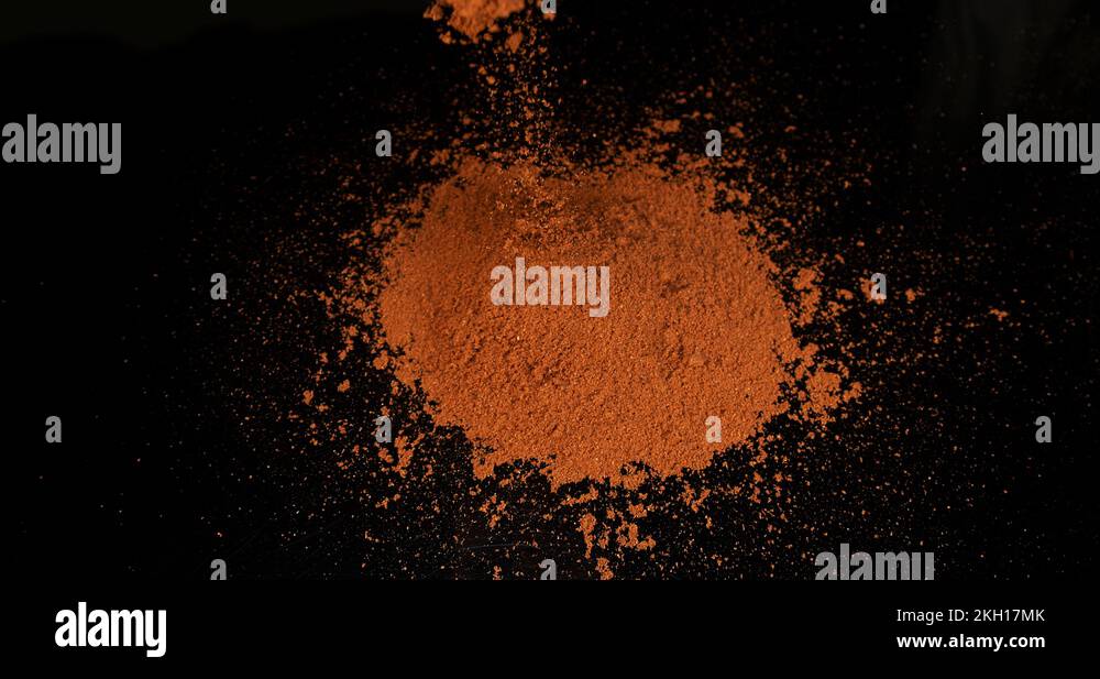 Paprika, capsicum annuum, Powder Falling against Black Background, Slow ...