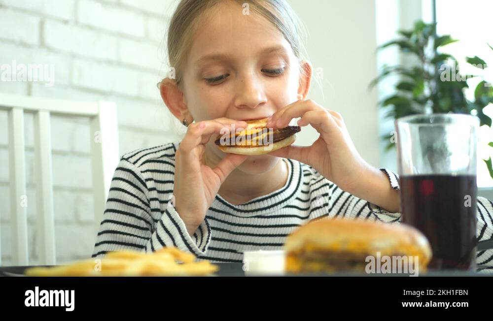 Child Eating Fast Food, Kid Eats Hamburger in Restaurant, Girl Drinking ...