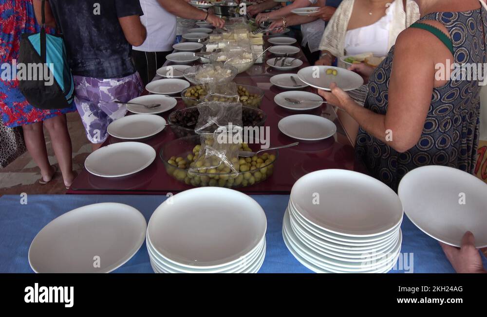 Tilt up People fill in their plates at buffet breakfast Stock Video ...