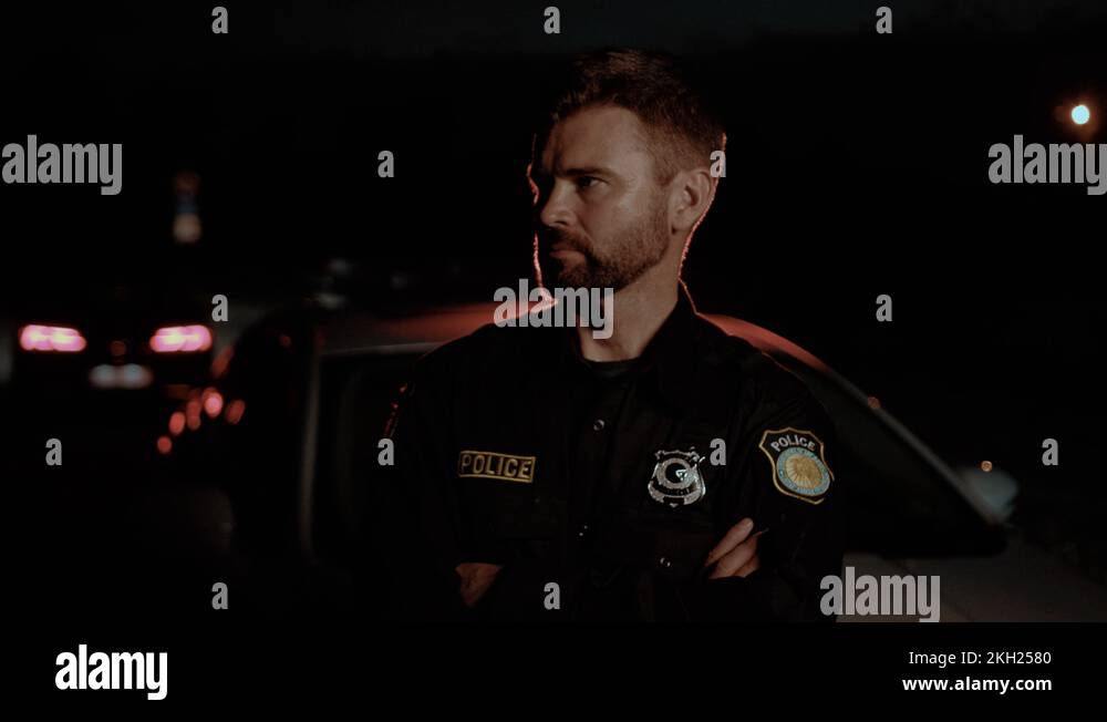 Confident police officer is standing with his arms crossed Stock Videos ...