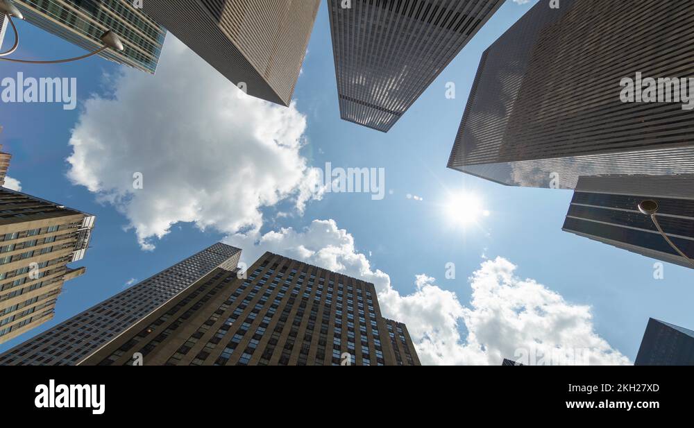 Corporate office buildings low angle rotate blue sky sunlight sun ...