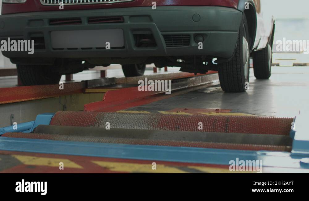 Checking the brake system of the car using the rollers at the service ...