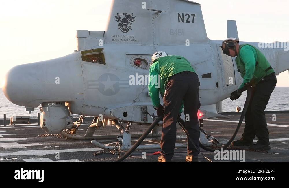 Deck crew disconnect fuel hose from MQ-8B Fire Scout aboard USS Milwaukee Stock Video Footage ...