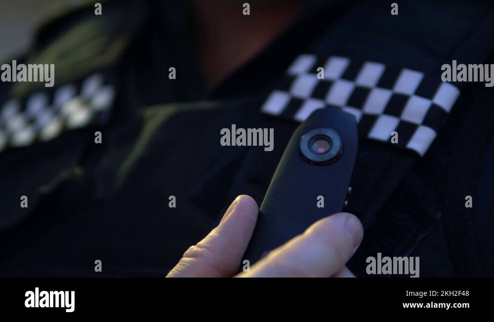 Male Police Officer Placing Body Camera On Tactical Vest, 4K Stock ...