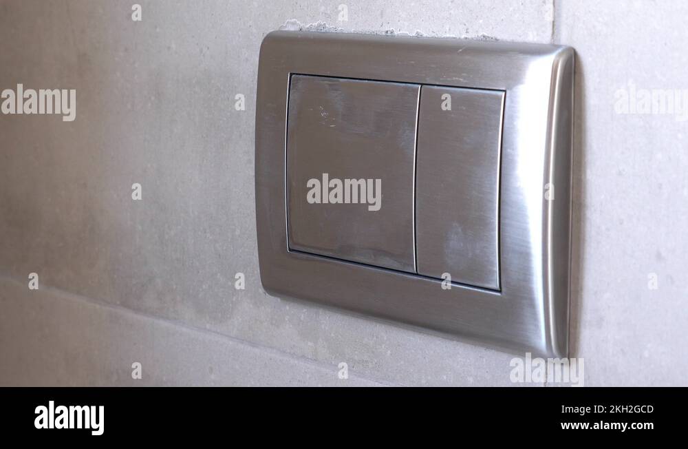 Man push flush button in modern restroom Stock Video Footage - Alamy