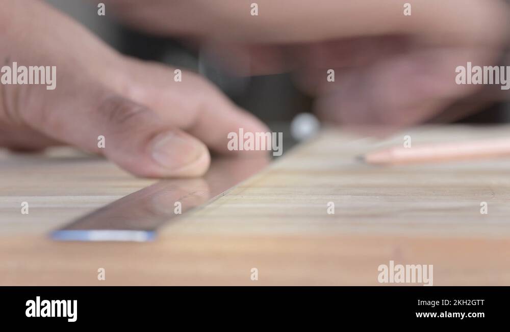 Carpenter use pencil Drawing a Line along the ruler Stock Video Footage ...