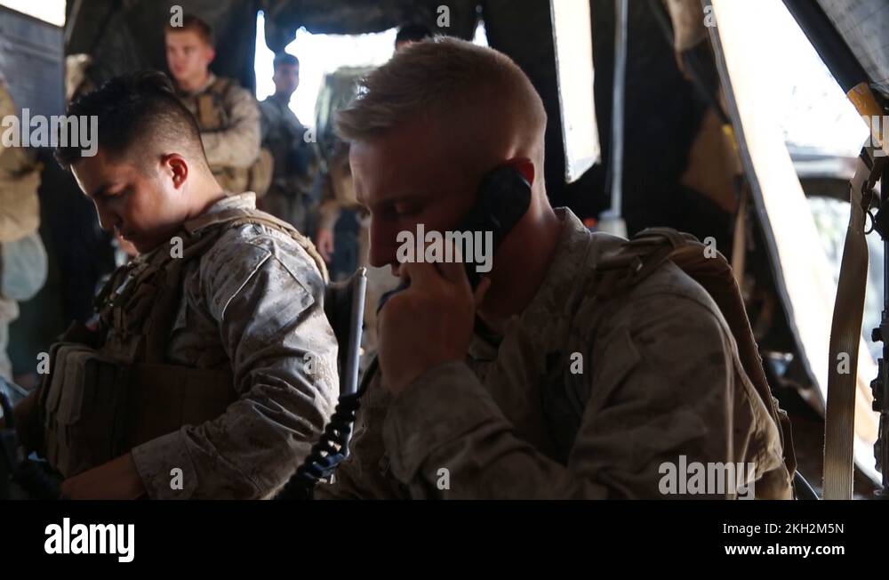 Soldier speaking on radio at mobile command post during exercise Summer ...