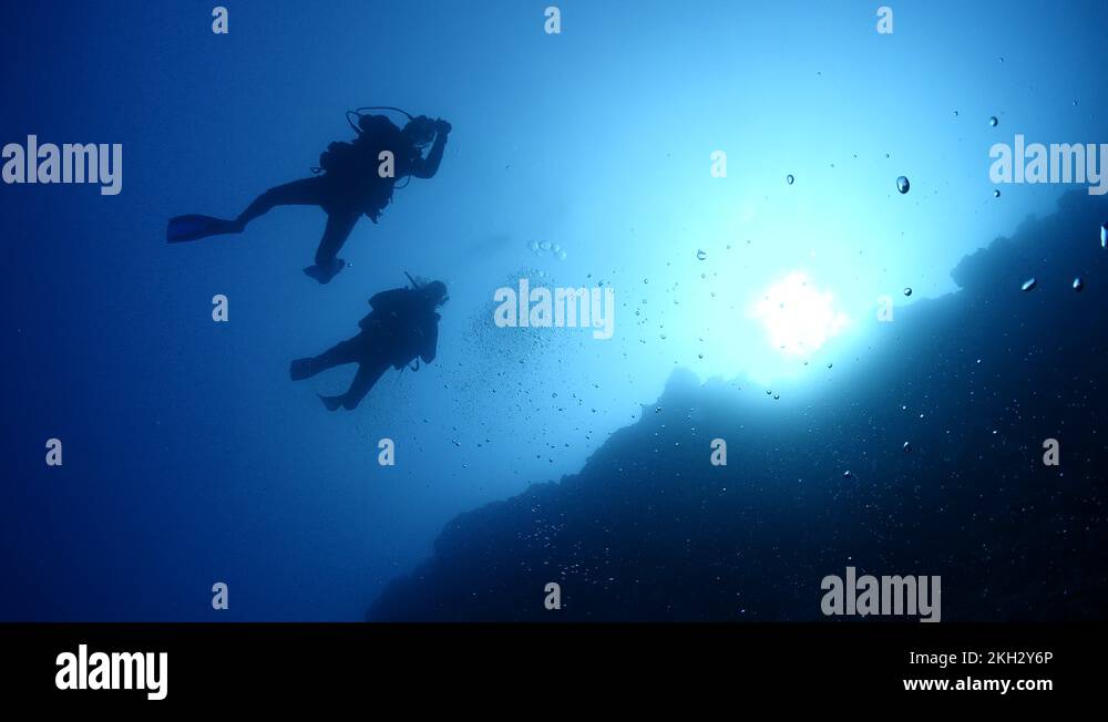 scuba diver scenery underwater reefs and nice light sun beams rays ...