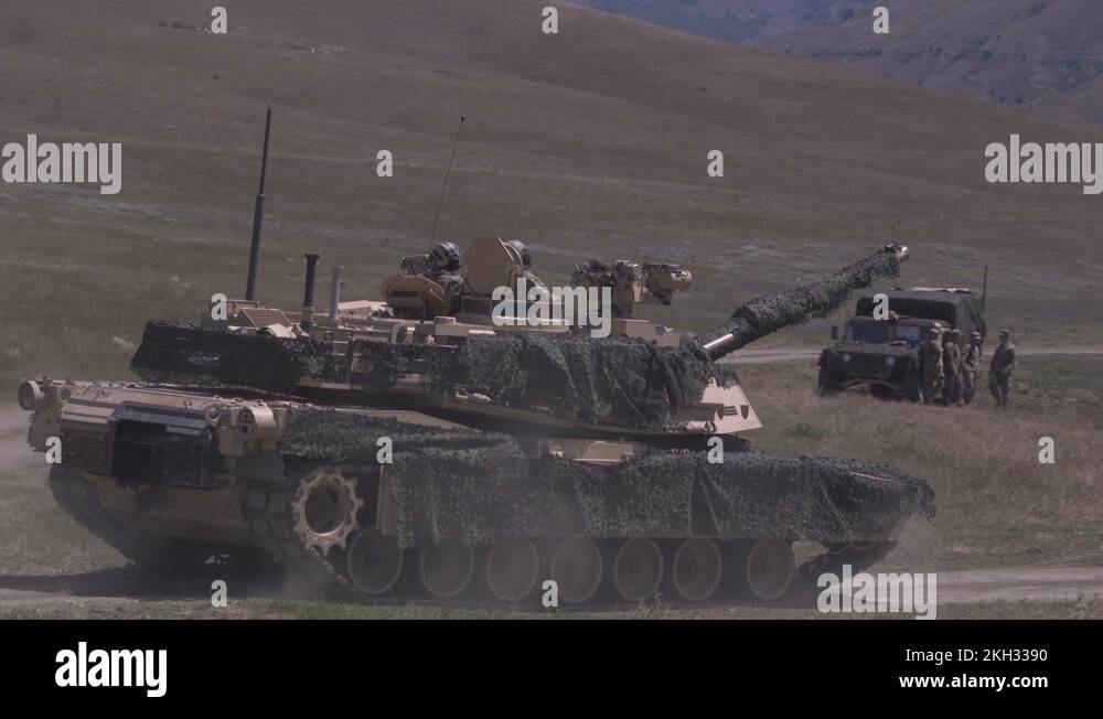 M1A1 Abrams tank travelling over dusty track during exercise Agile ...