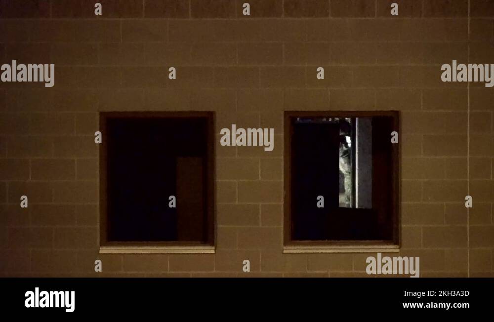 External view through window of soldiers entering building using ...