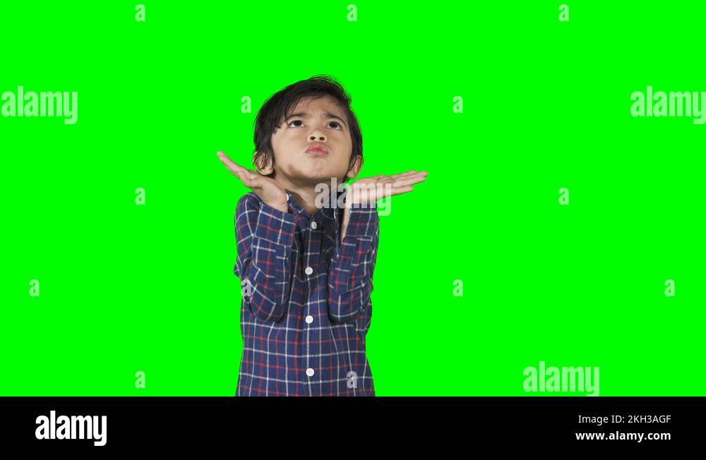 Confused little boy looking up and lifting arms Stock Video Footage - Alamy