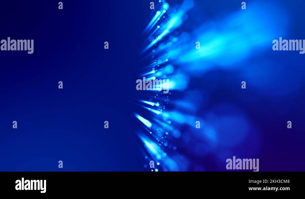 blue shiny sparkling particles with light rays move in a viscous liquid ...