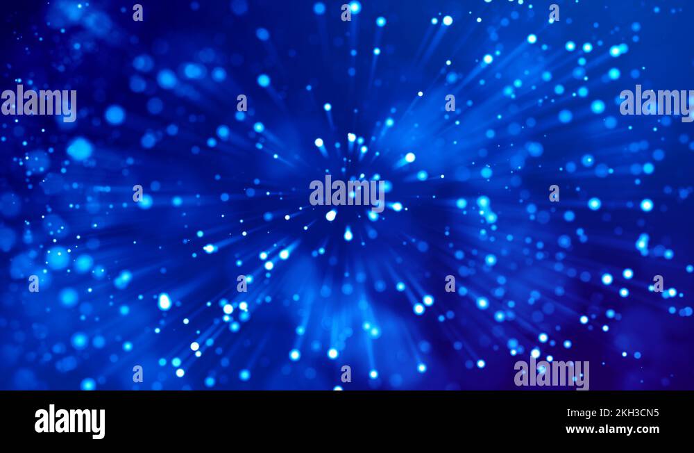 blue shiny sparkling particles with light rays move in a viscous liquid ...