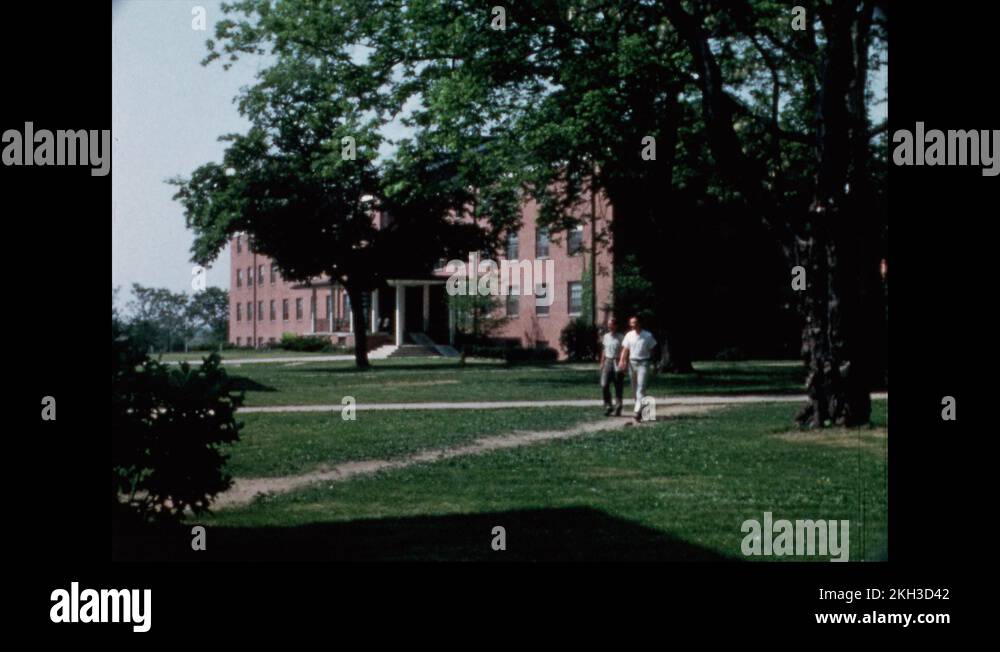 1950s: Students walk across campus grounds. Women in dorm room study ...