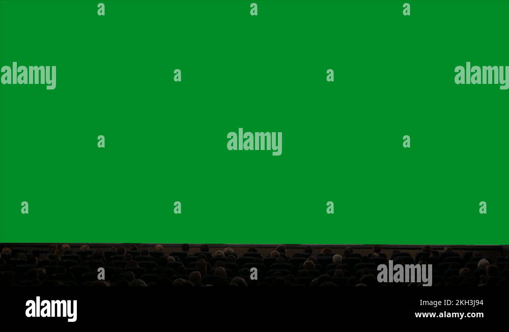 People sit in the auditorium and look at the green screen Stock Video ...