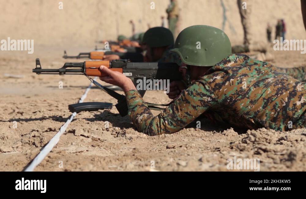 Iraqi soldiers shooting AK-47 assault rifles at firing range Stock ...