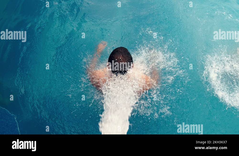 Men relaxing under water jet in a swimming pool Stock Video Footage - Alamy