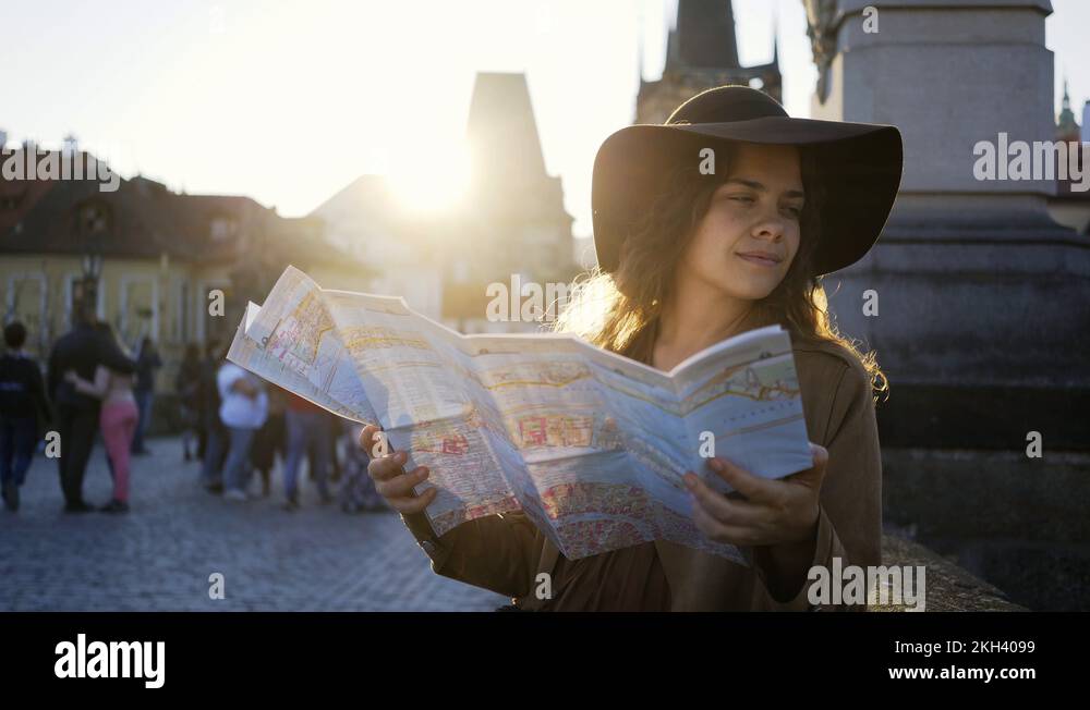 Girl looking at map on charles bridge in Prague Stock Video Footage - Alamy