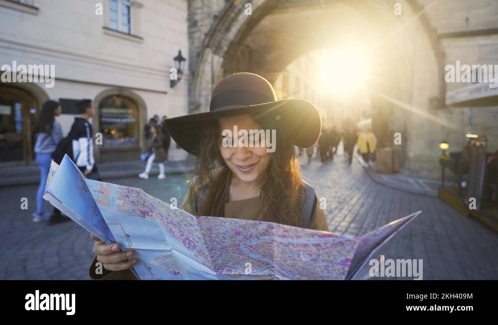 Girl with map walking on street in old centre of Prague Stock Video ...