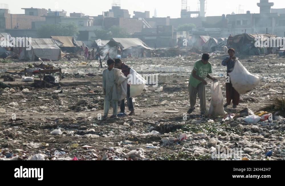 Young Boys Remove Bags Of Dumped Trash In The Slums Of Pakistan Stock ...