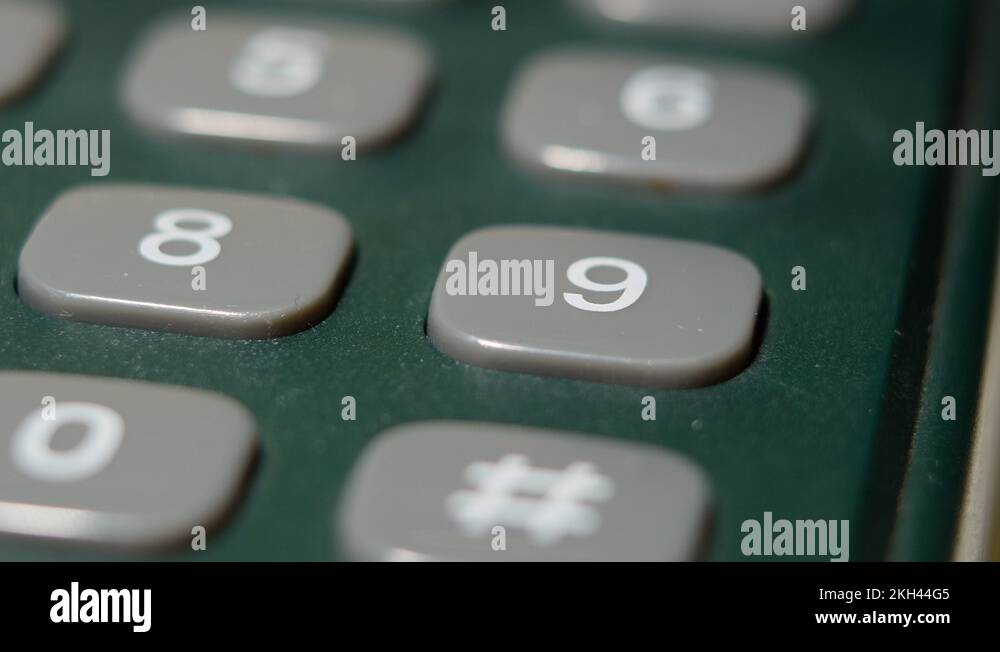 Men's Finger Dials On The Number Nine Button On The A Wired Phone Stock ...