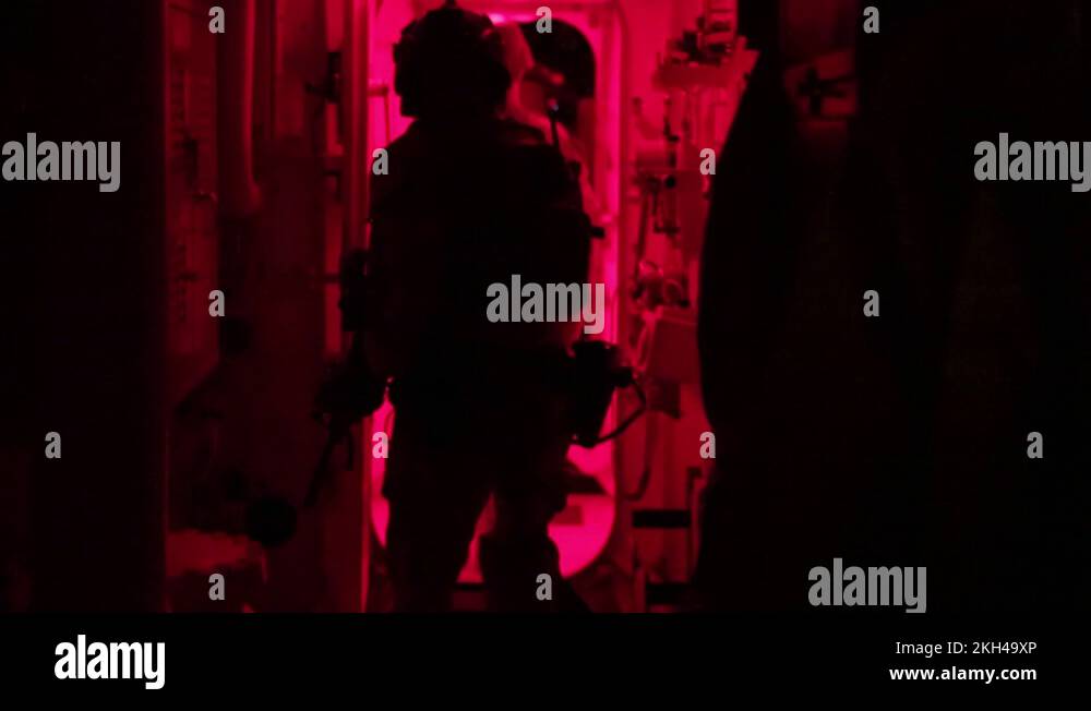 Night vision imagery of marines patrolling pasageways aboard USS John P ...