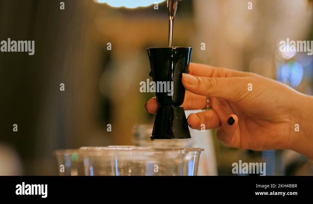 Barmaid Hands Pouring Alcohol to Cocktail Drinks in Bar or Night Club ...