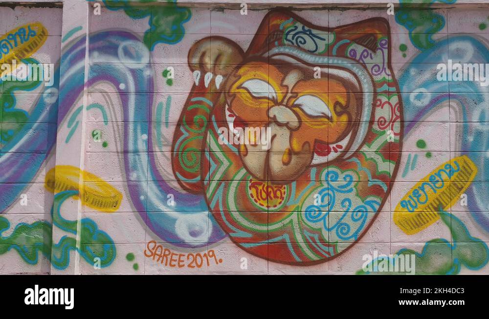 Graffiti on wall at public street in Lopburi, Thailand Stock Video ...