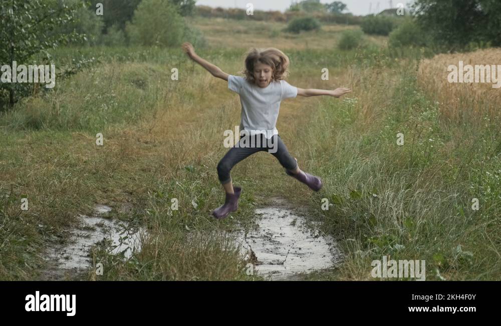 Muddy puddle jumping Stock Videos & Footage - HD and 4K Video Clips - Alamy